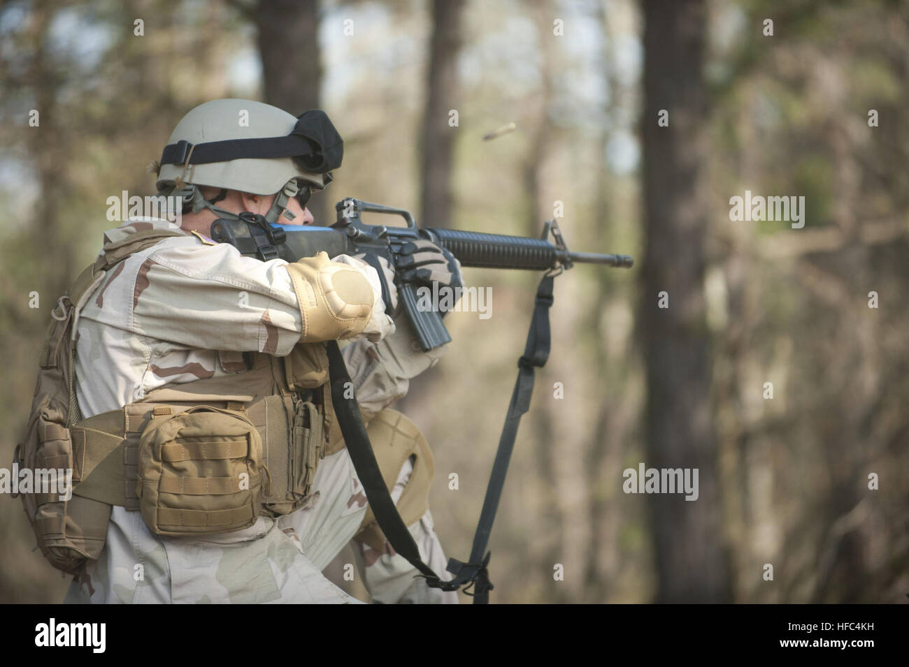 A Coast Guard Port Security Unit 307 member qualifies with the M16 ...