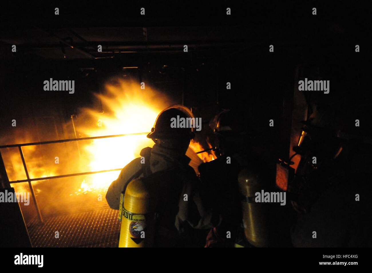 Damage control firefighting sailors hi-res stock photography and images ...