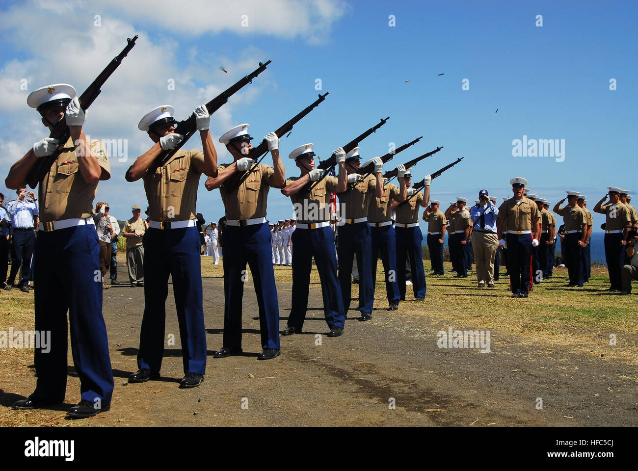 A U.S. Marine Corps honor guard fires a rifle volley during the Reunion ...