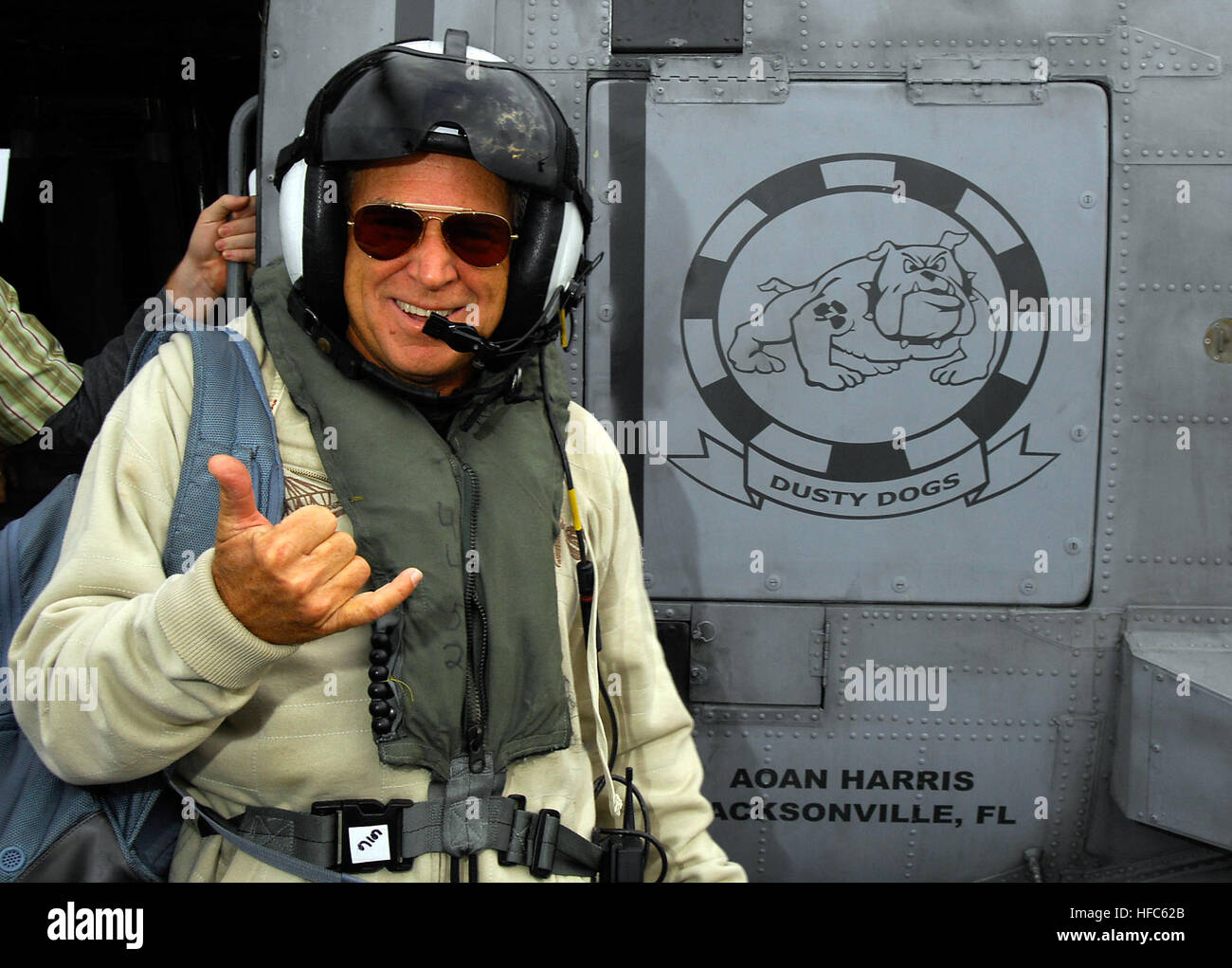 Recording artist Jimmy Buffett gives the sign to "hang loose" after ...