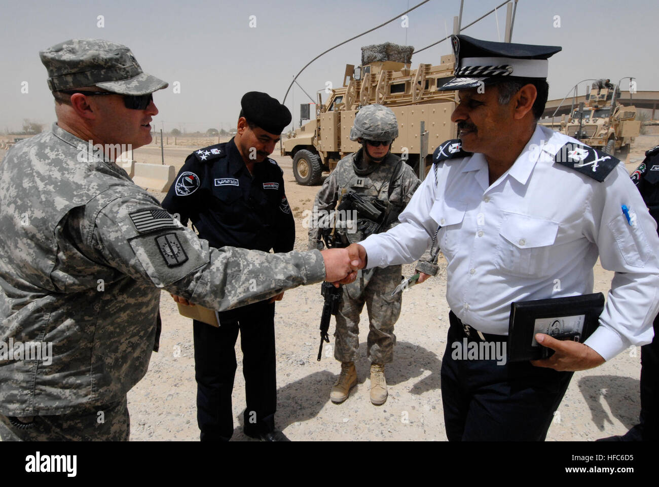 Iraqi police and U.S. Military Police conduct a joint law enforcement ...
