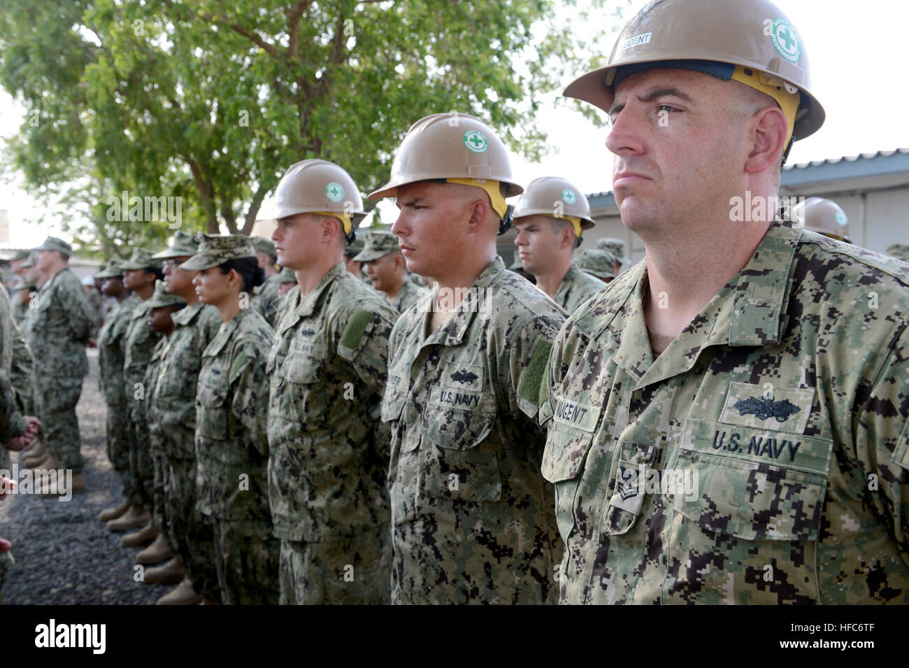 Sailors assigned to Naval Mobile Construction Battalion (NMCB) 11 stand ...