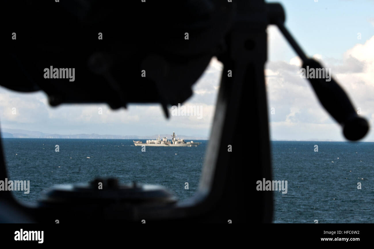 The frigate HMS Kent (F78) coasts near the guided missile cruiser USS ...