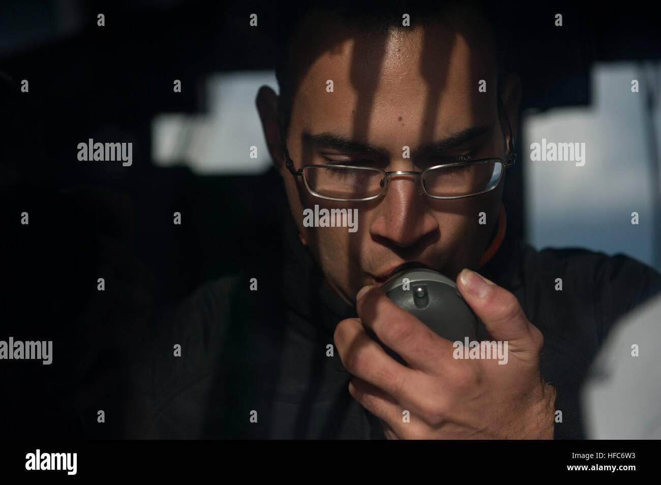 U.S. Navy Fire Controlman 2nd Class Yasser Rady operates a long range ...