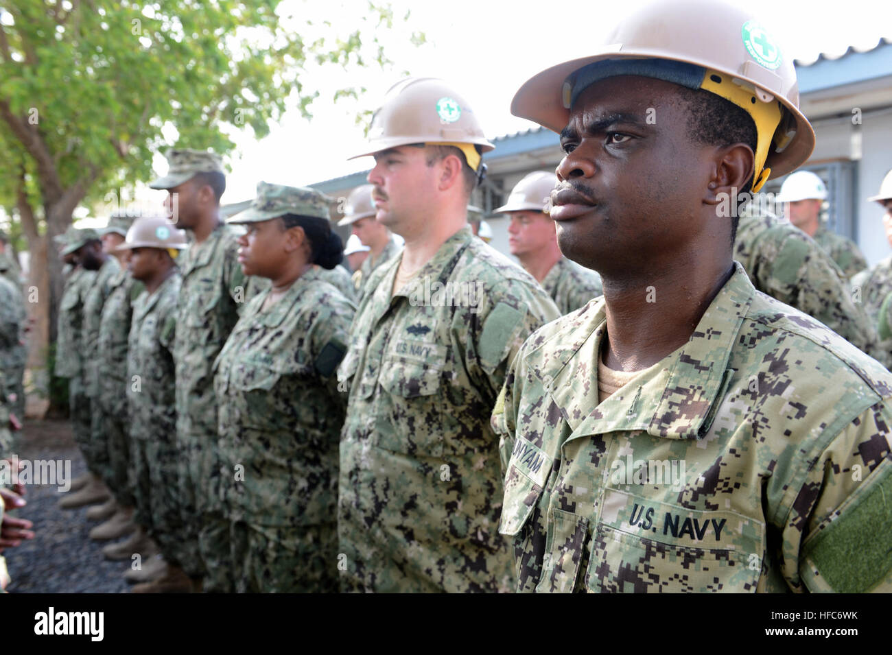 Sailors assigned to Naval Mobile Construction Battalion (NMCB) 11 stand ...