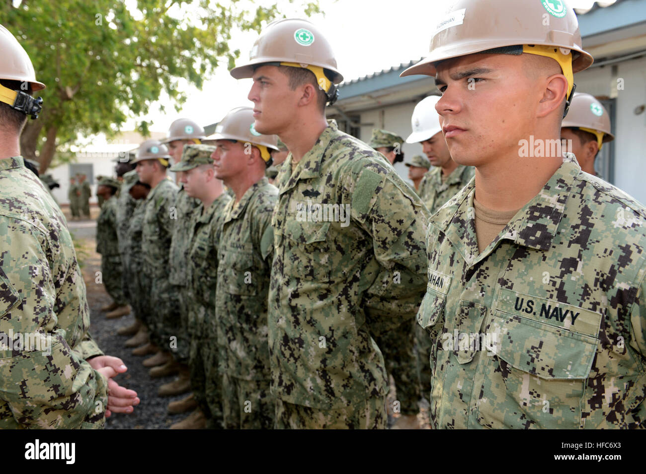 Sailors assigned to Naval Mobile Construction Battalion (NMCB) 11 stand ...