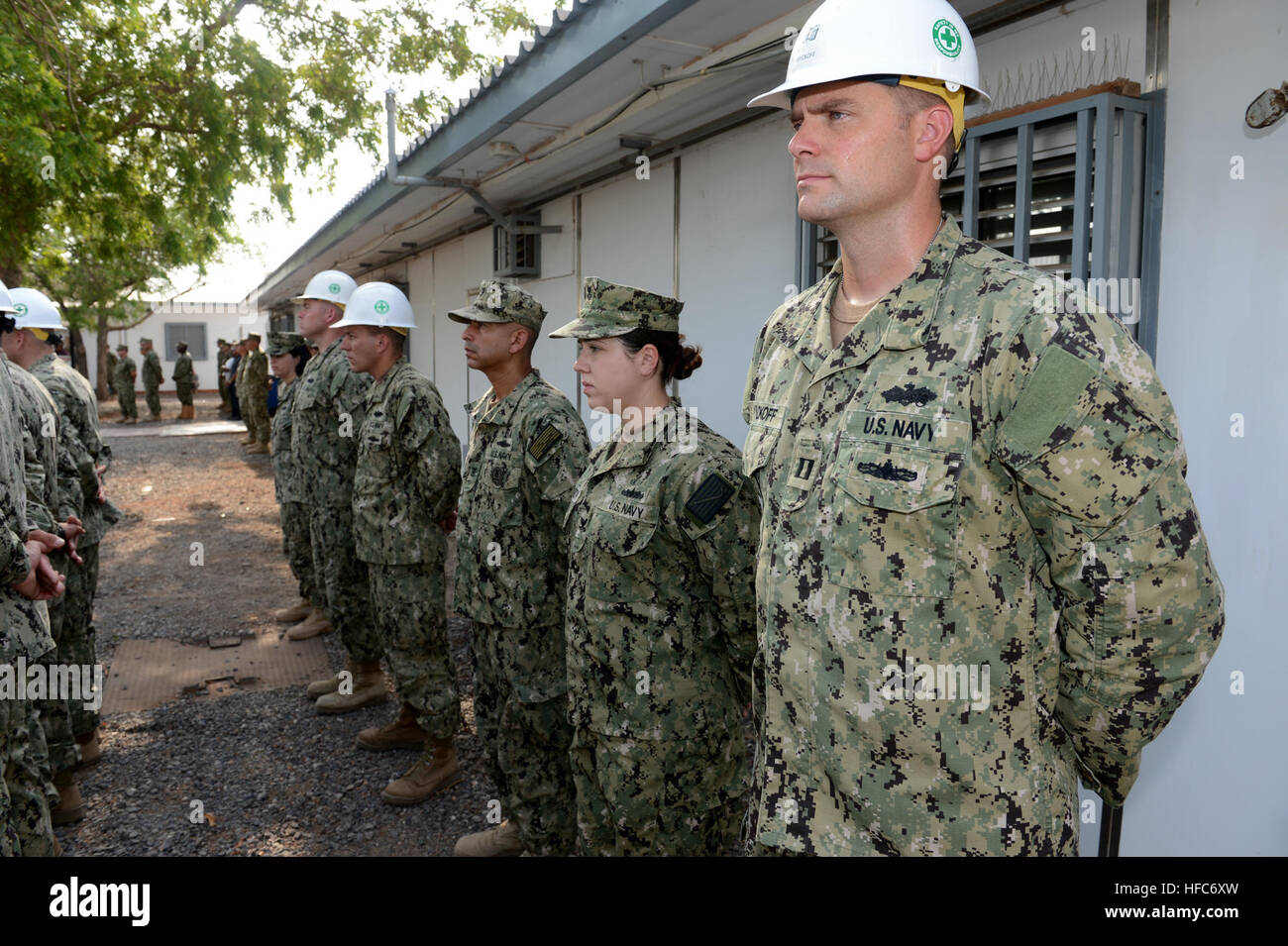 Sailors assigned to Naval Mobile Construction Battalion (NMCB) 11 stand ...