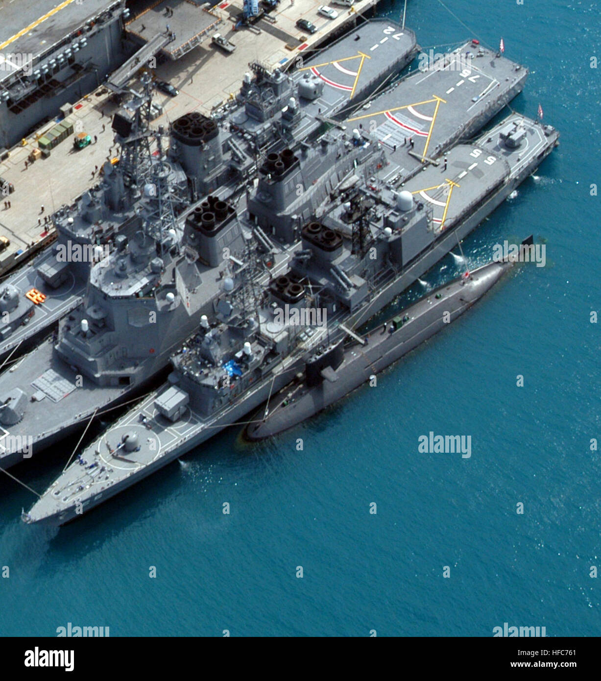At White Beach Port Facility, Okinawa, the amphibious assault ship USS ...