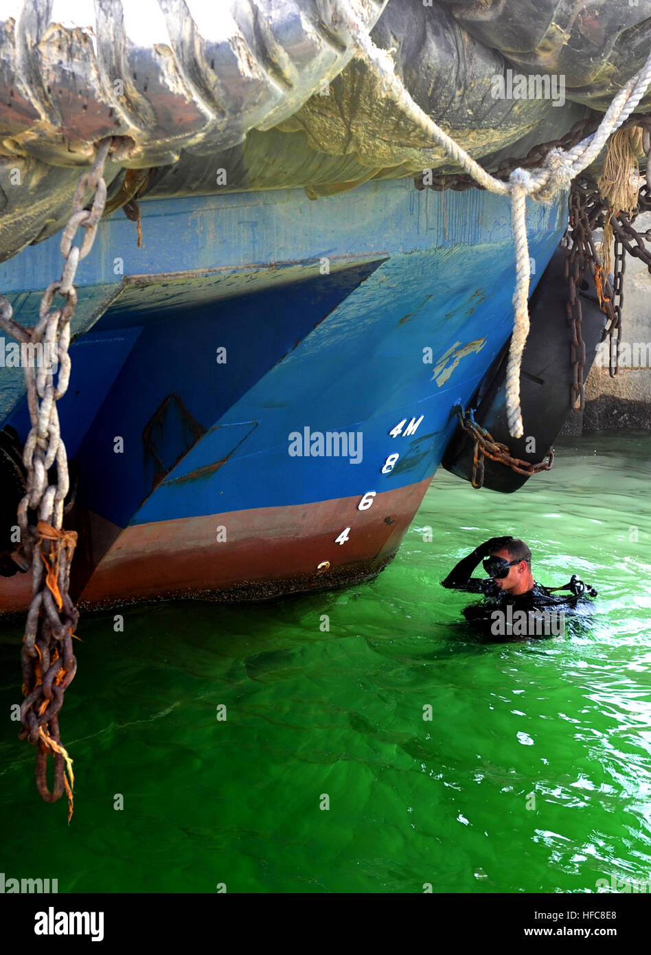 U.S. Navy diver from Mobile Diving and Salvage Unit 2 surfaces to ...