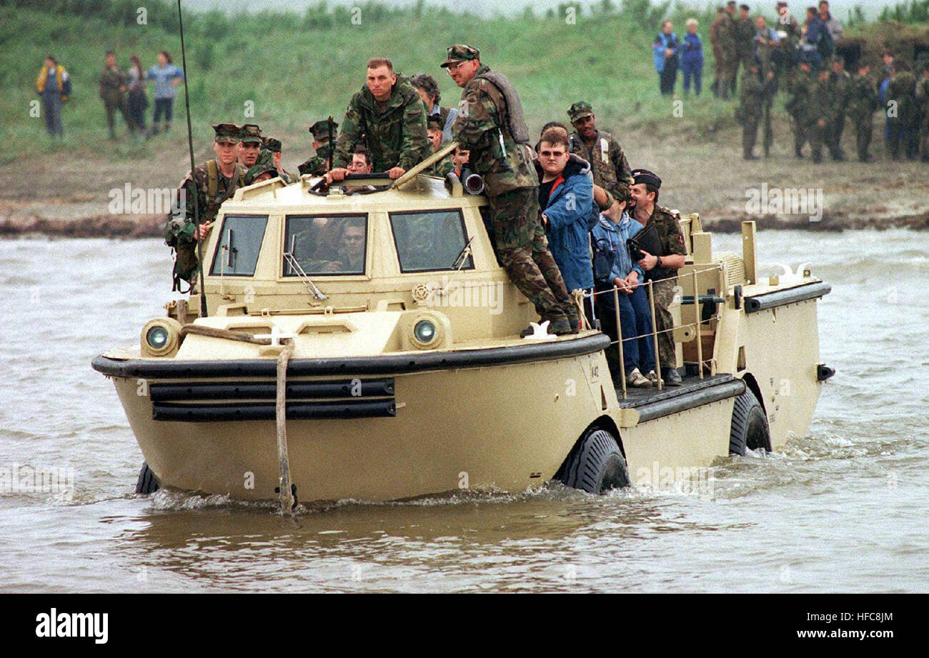 A Light Amphibious Reconnaissance Craft (LARC) filled with US Sailors ...