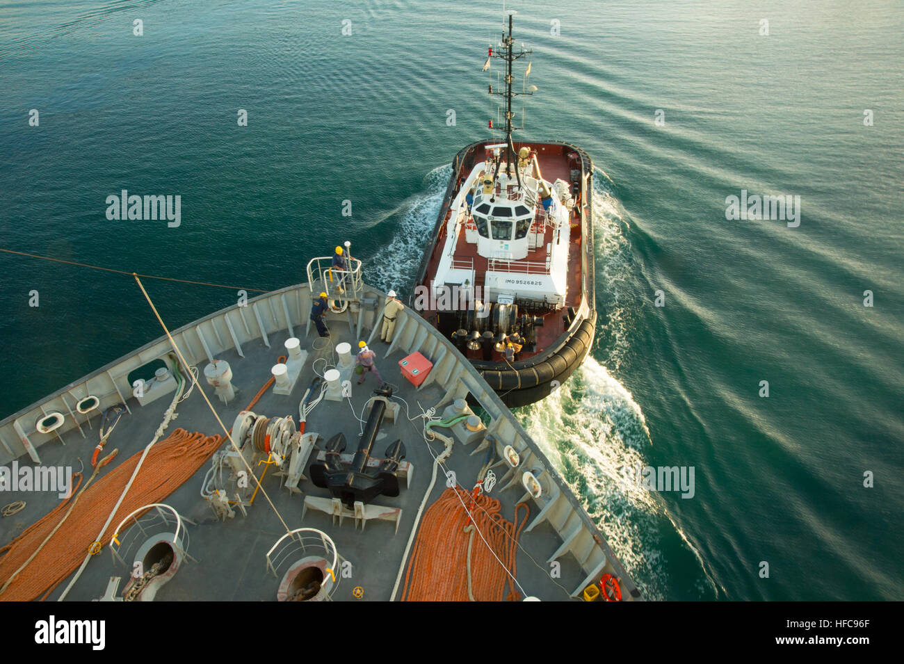 Line handlers aboard the roll-on/roll-off and container ship MV Cape ...