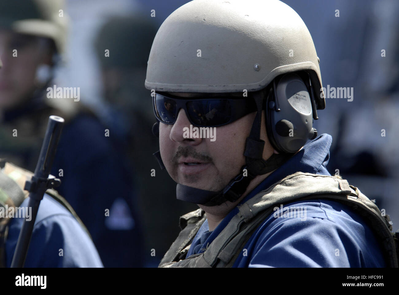 Chief Gunner’s Mate (SW/AW) Jeff Palma supervises a gun shoot during a ...