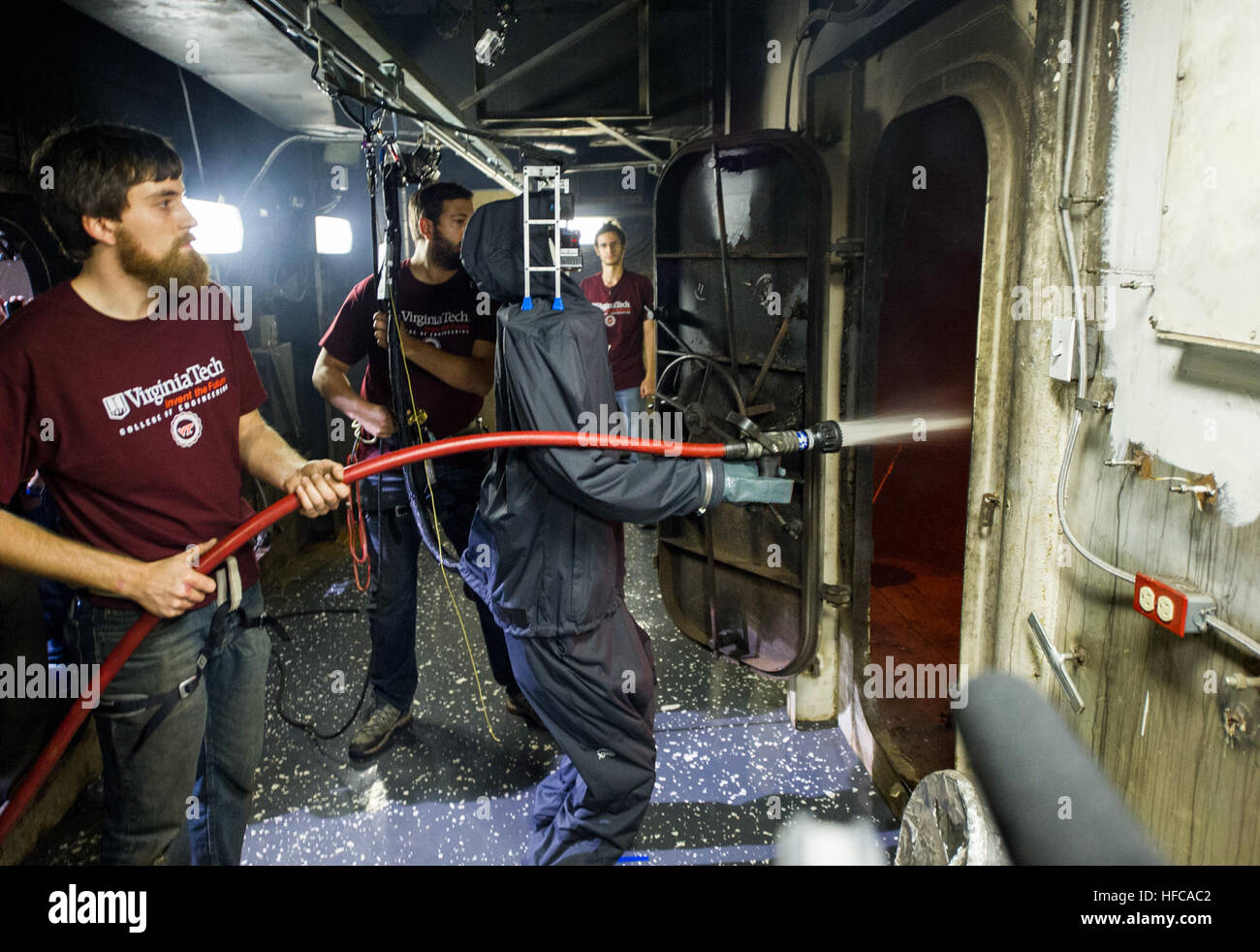 Coleman Knabe, a graduate student at Virginia Tech, assists as the ...
