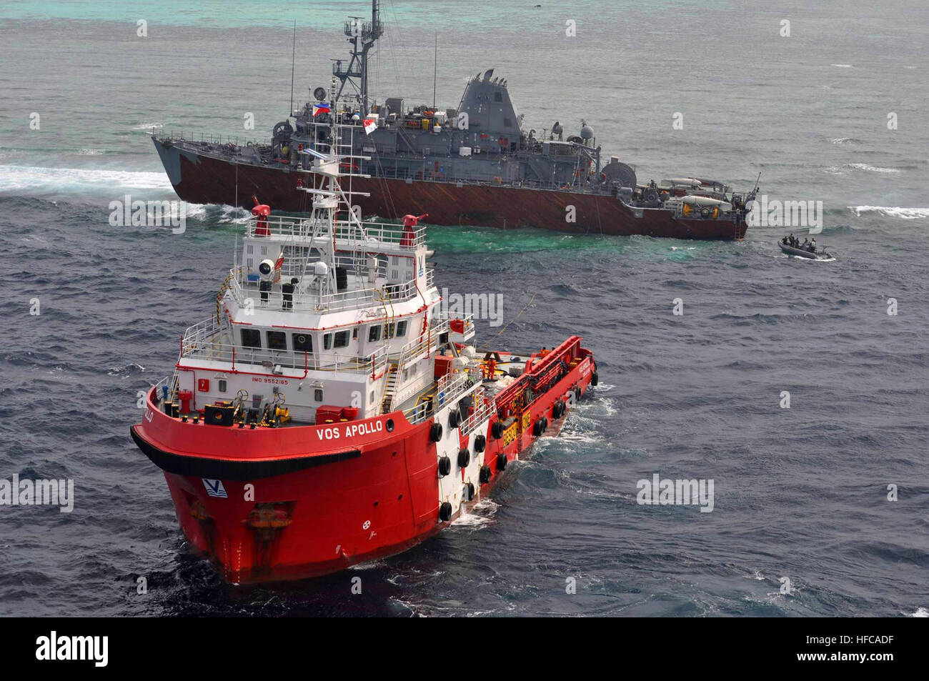SULU SEA (Jan. 24, 2013) Malaysian tug Vos Apollo, foreground, prepares ...