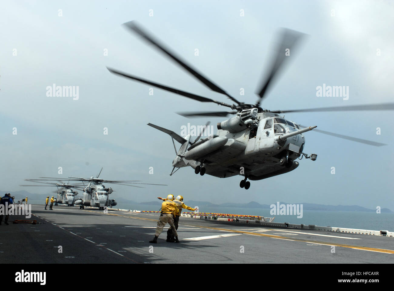 A Marine MH-53 helicopter from HMM-265 operates from USS Essex during ...