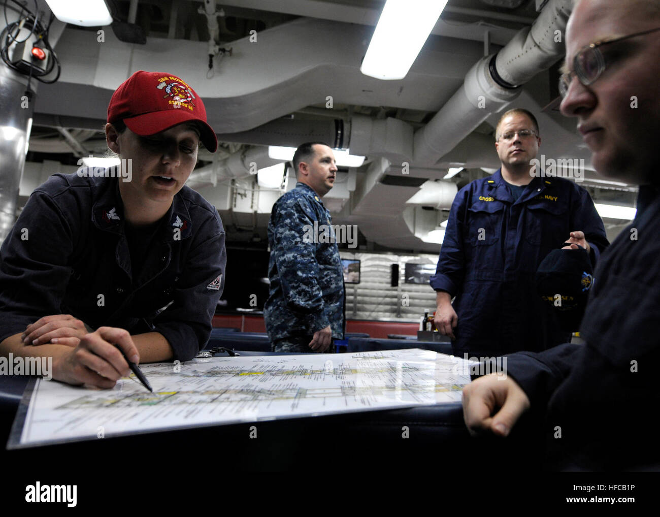 A damage controlman trains aboard USS Momsen (DDG 92) to mark a damage ...