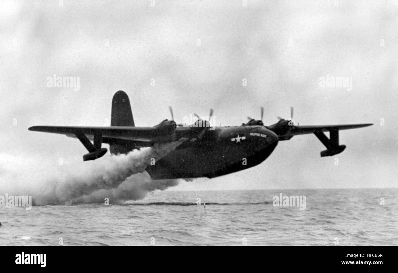 A Martin Philippine Mars aircraft performs a rocket-assisted takeoff ...