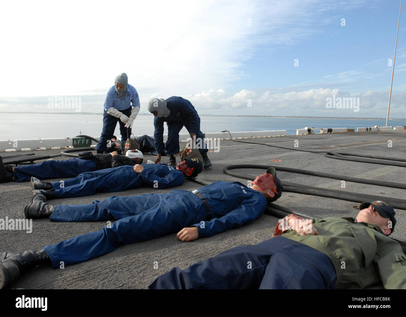 Operations specialist Petty Officer 3rd Class Vania Lupe, left, and ...