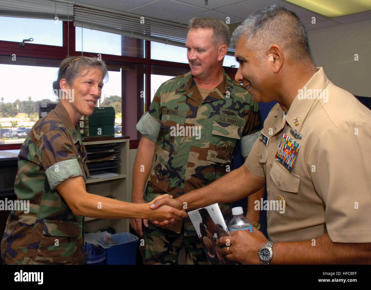 Master Chief Petty Officer of the Navy (MCPON) Joe R. Campa Jr. shakes ...