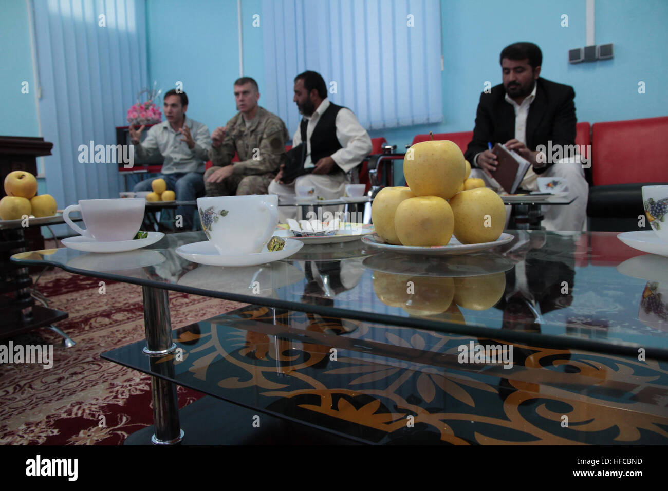 Traditional Afghan tea and apples sit on a table during a key leader ...
