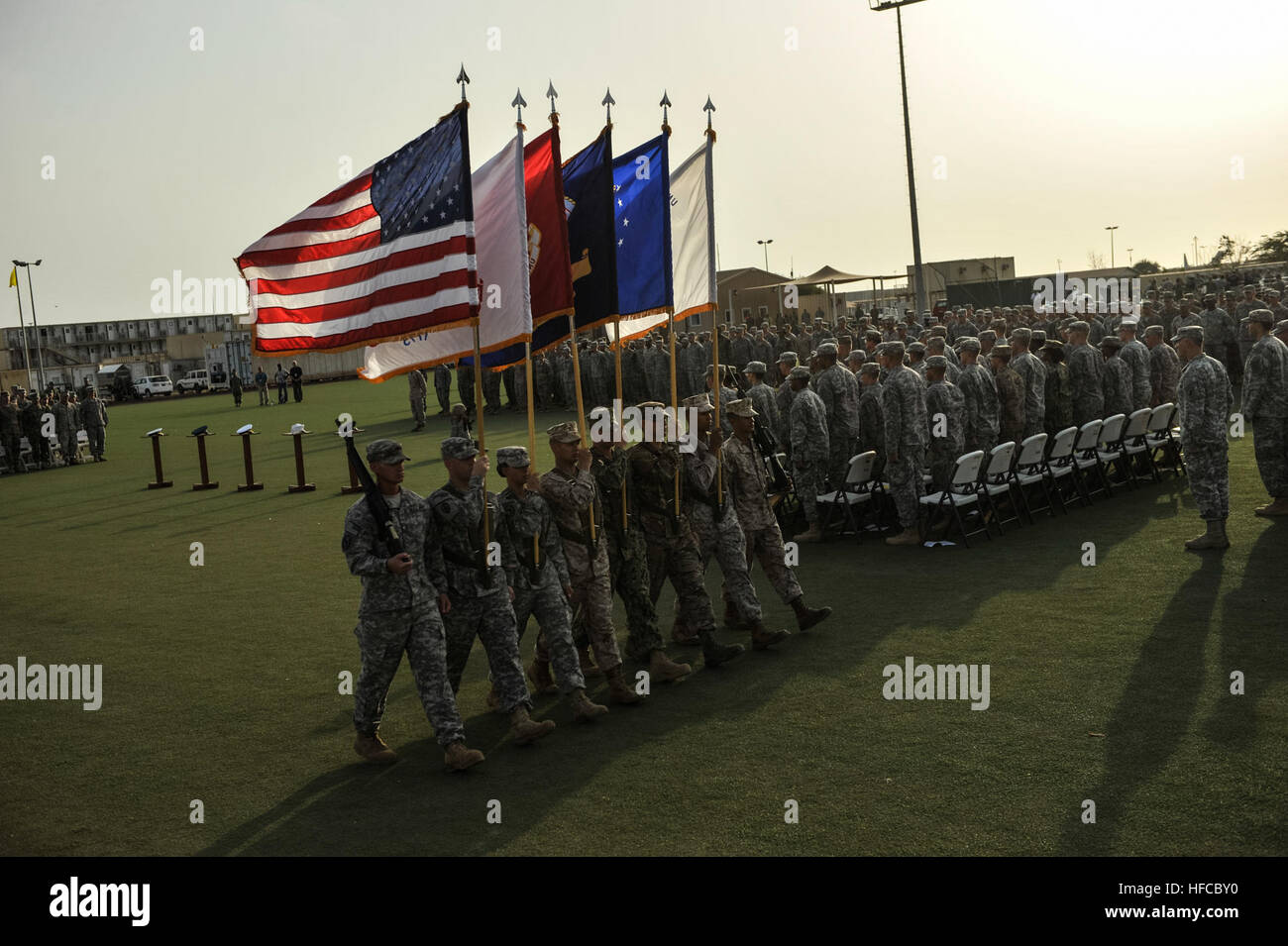 A color guard marches during a Memorial Day ceremony at Camp Lemonnier ...