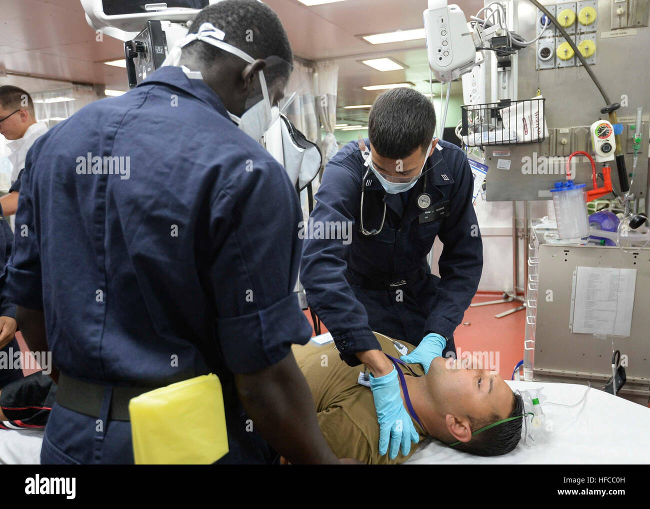 PHILIPPINE SEA (July 16, 2015) Crew members on board the hospital ship ...