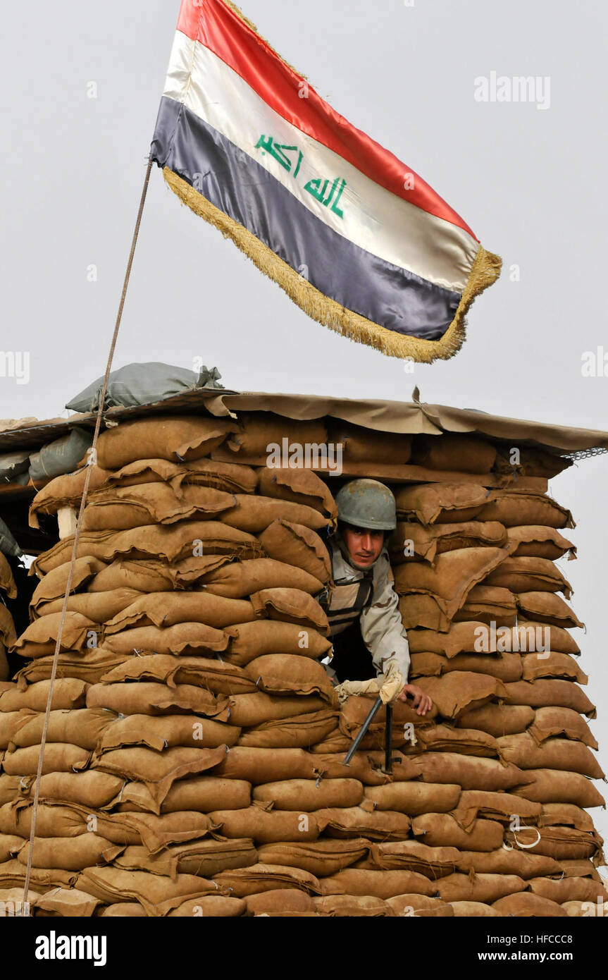 An Iraqi army soldier mans a checkpoint firing position as U.S ...