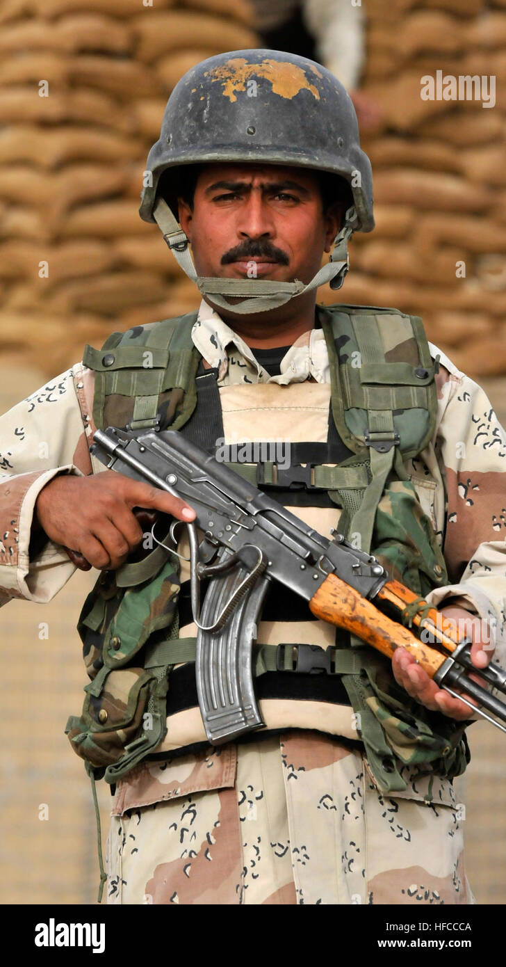 An Iraqi army soldier poses for the camera as U.S. Soldiers from ...