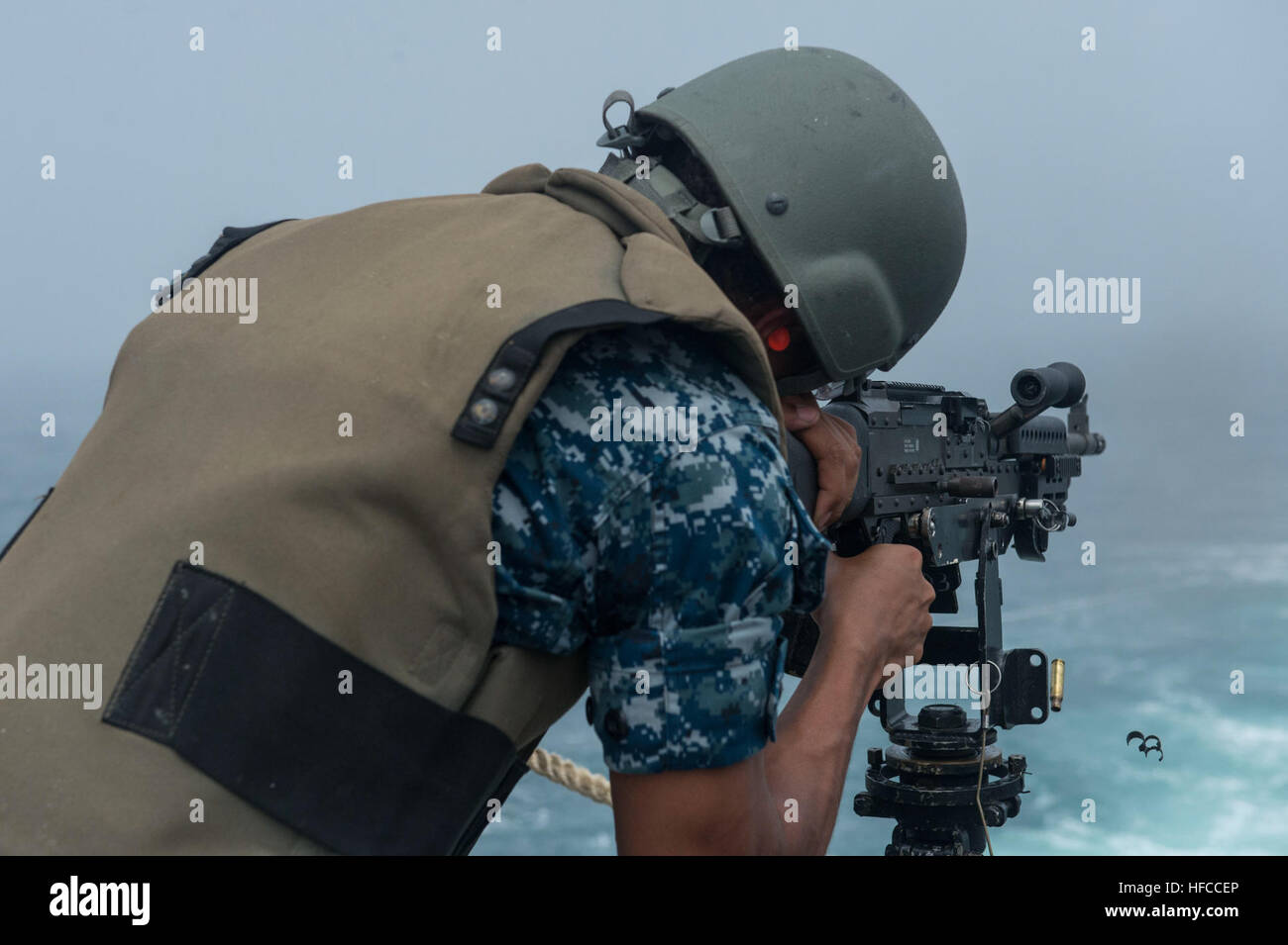 U.S. Naval Academy Midshipman 2nd Class Michael Brown fires an M240B ...