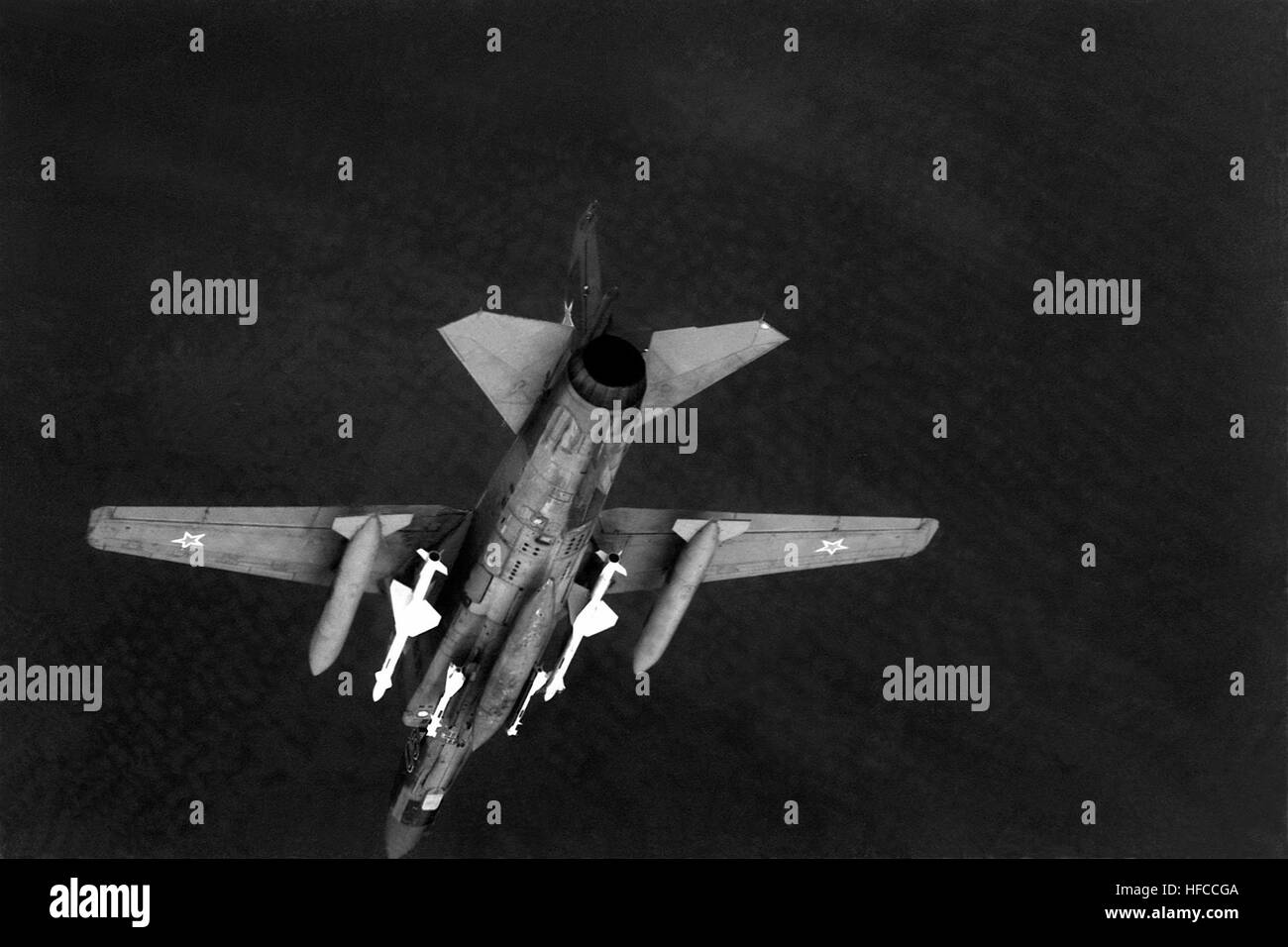 An air-to-air underside view of a Soviet MiG-23 Flogger aircraft. The ...