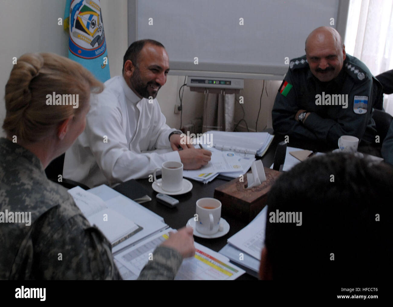Afghanistan's Minister of Interior, Hanif Atmar, signs the new ...