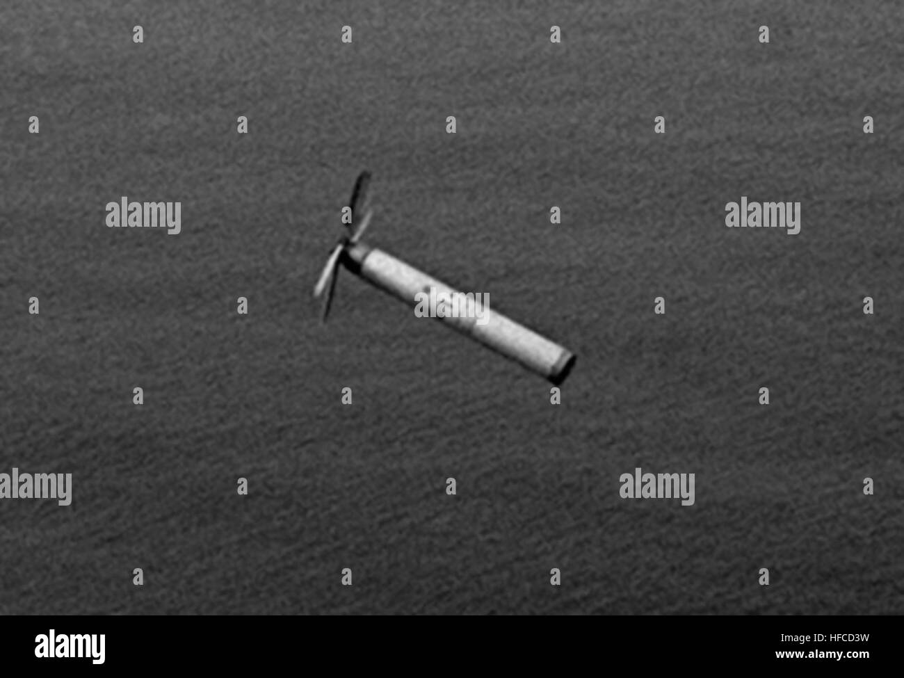 A Mk 46 torpedo is deployed from an SH-2F Sea Sprite helicopter ...