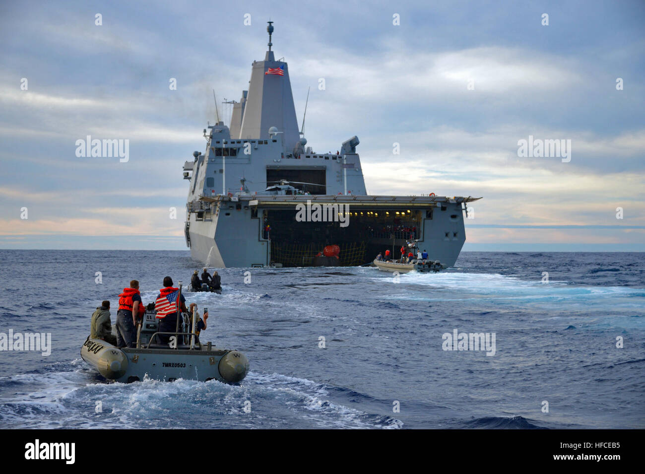 Sailors from the amphibious transport dock, USS Anchorage (LPD 23), and ...