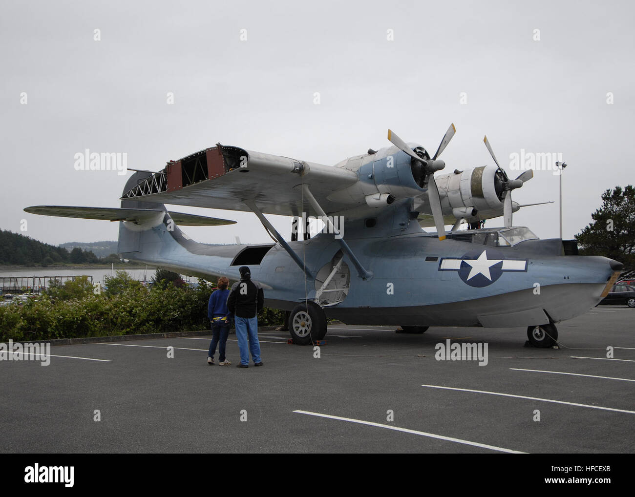 A father and daughter look at a World War II-era PBY-5A seaplane at ...