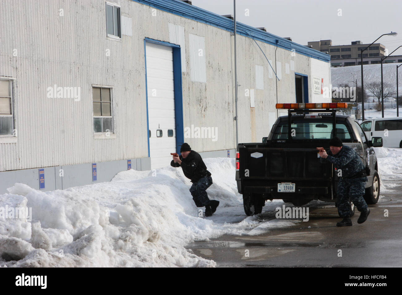 Master-at-Arms 1st Class Travis Clouse, left, and Master-at-Arms 1st ...
