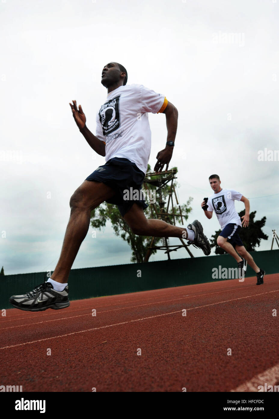 Sailors assigned to Naval Base San Diego complete a 5k run during the ...