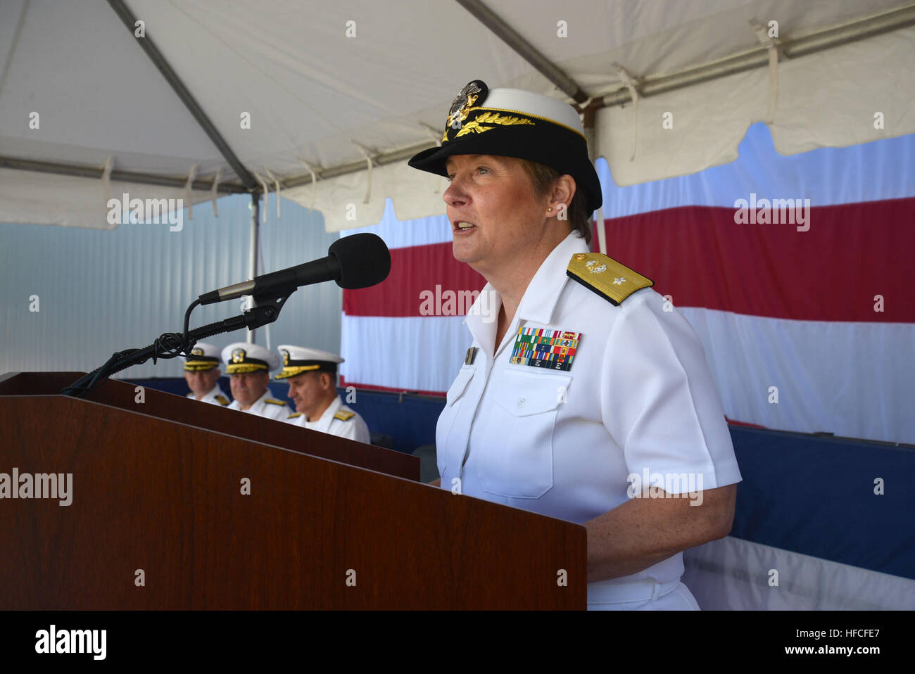 Rear Adm. Valerie Huegel gives her remarks after assuming command of ...