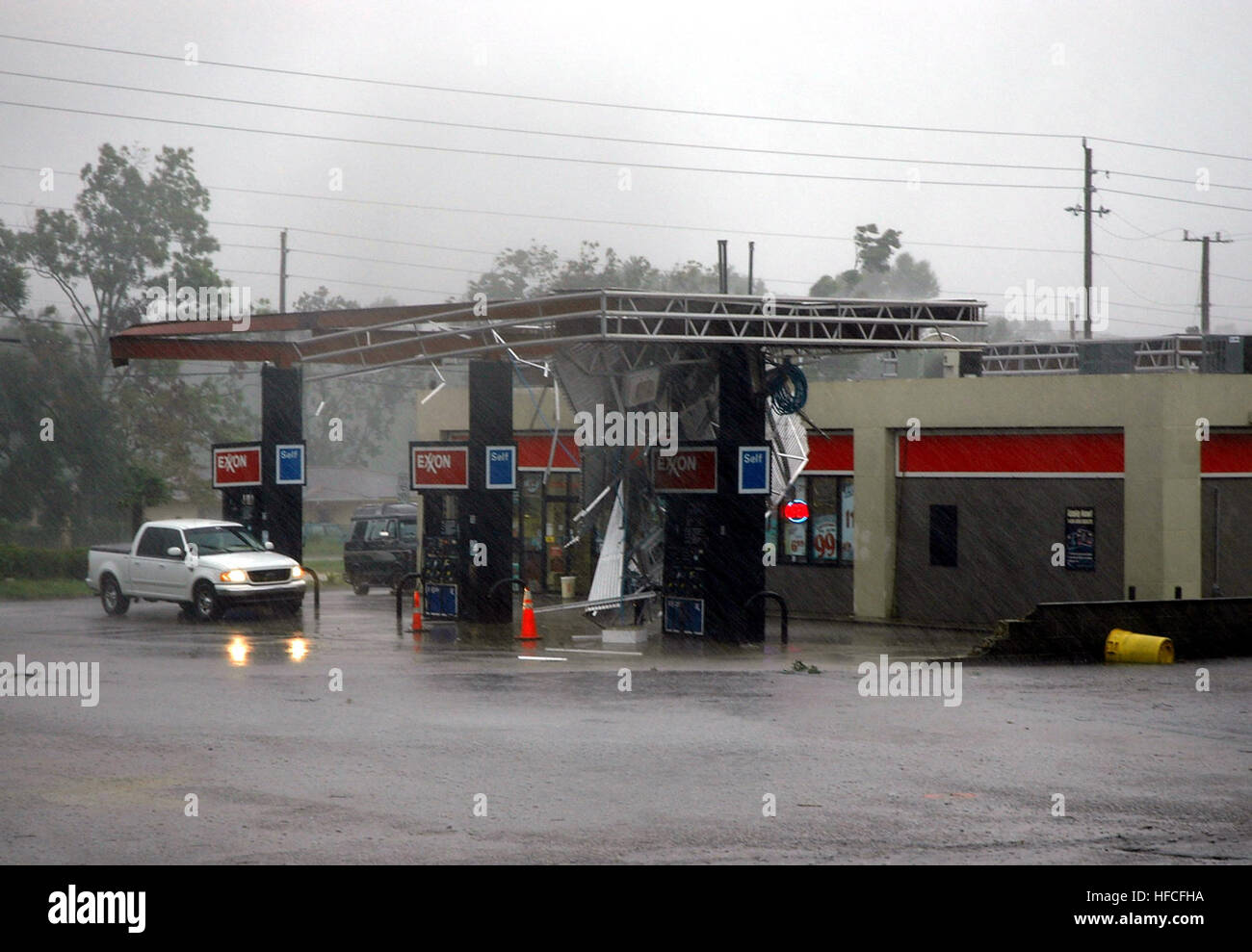 An Exxon gas station in Pensacola, Florida, remains open despite losing ...
