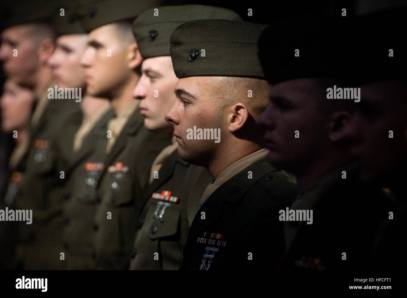 Marines stand at parade rest during a Navy Cross ceremony in honor of ...
