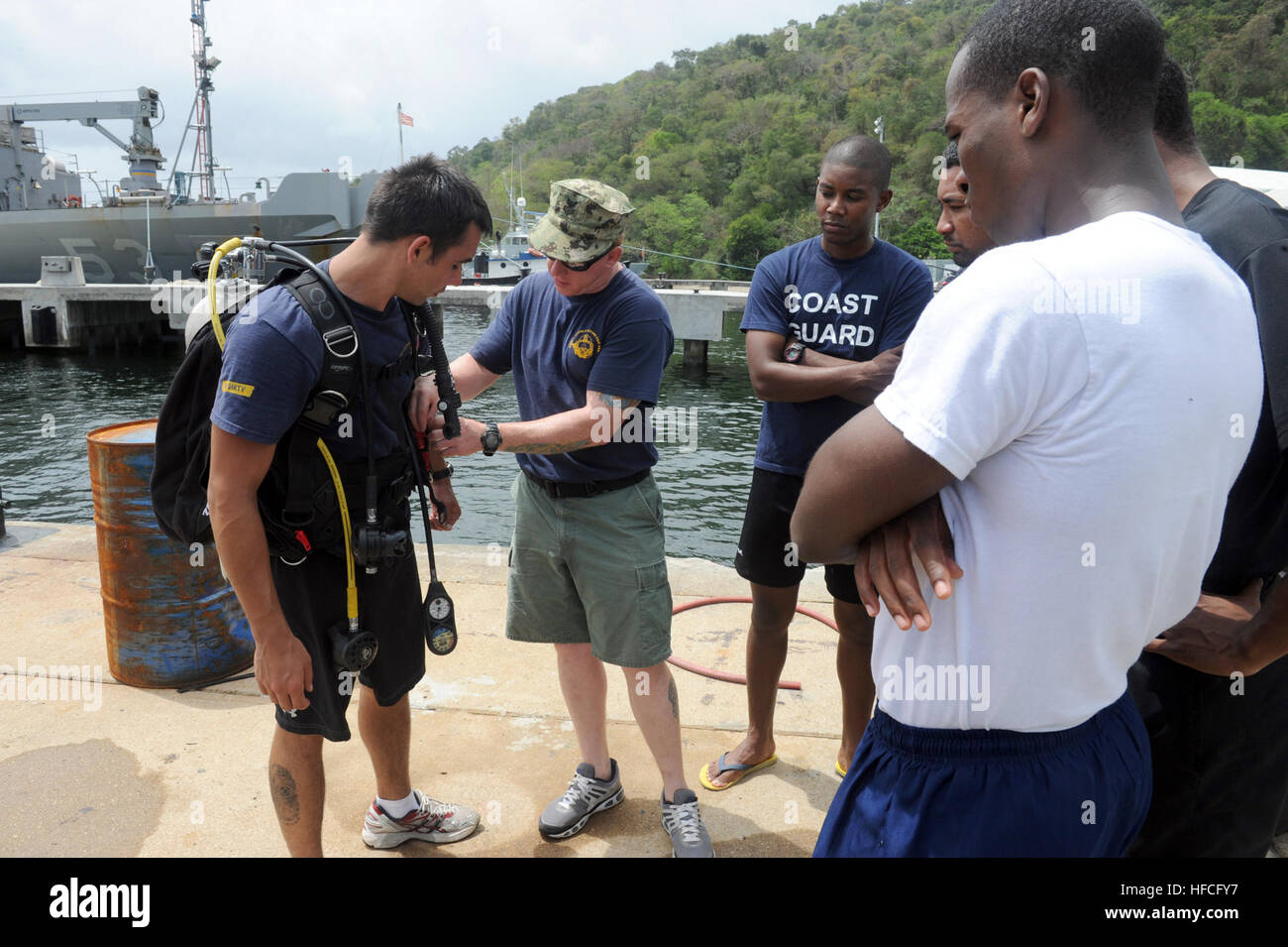 Navy Diver 2nd Class Matthew Kelly wears a scuba rig while Navy Diver ...