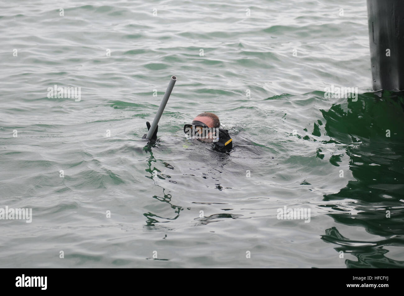 Petty Officer 2nd Class Nick Barna, a basic diver assigned to Navy Dive ...