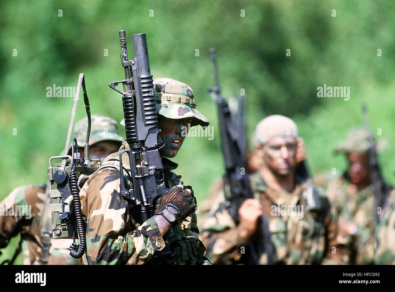 U.S. Navy Sea-Air-Land (SEAL) team members participate in a tactical ...
