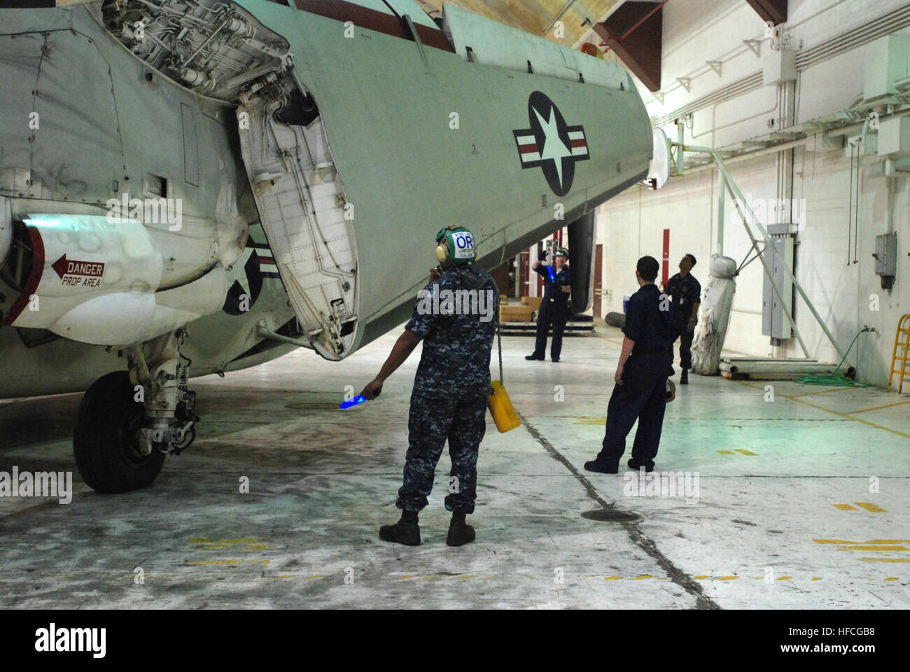Flight crews direct a C-2 Greyhound in position at U.S. Naval Station ...