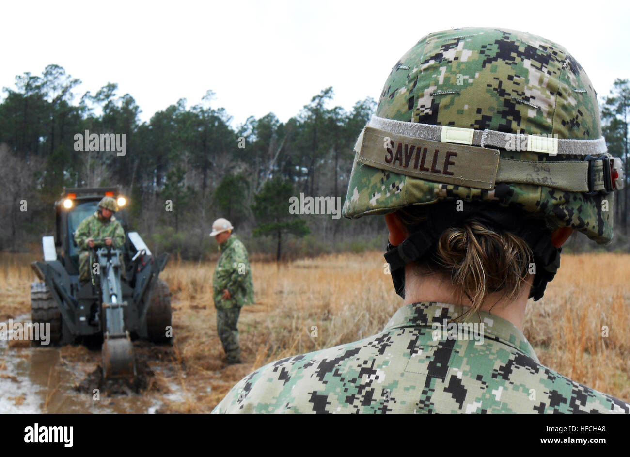 Senior Chief Equipment Operator Lori Saville watches members of Naval ...
