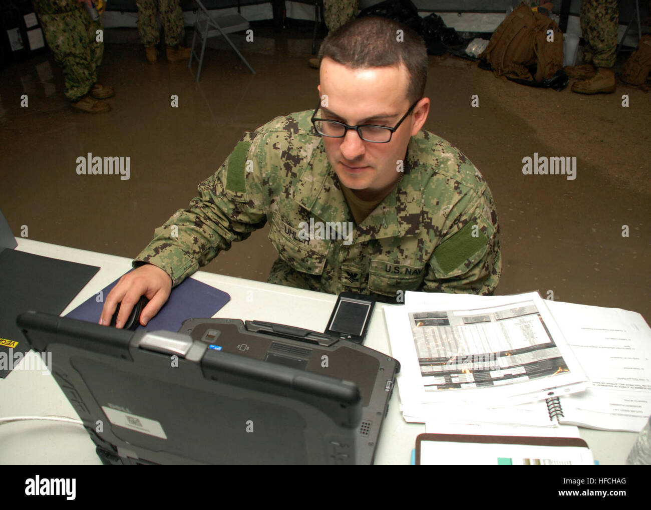 Builder 2nd Class Derick Uhler, of Naval Mobile Construction Battalion ...