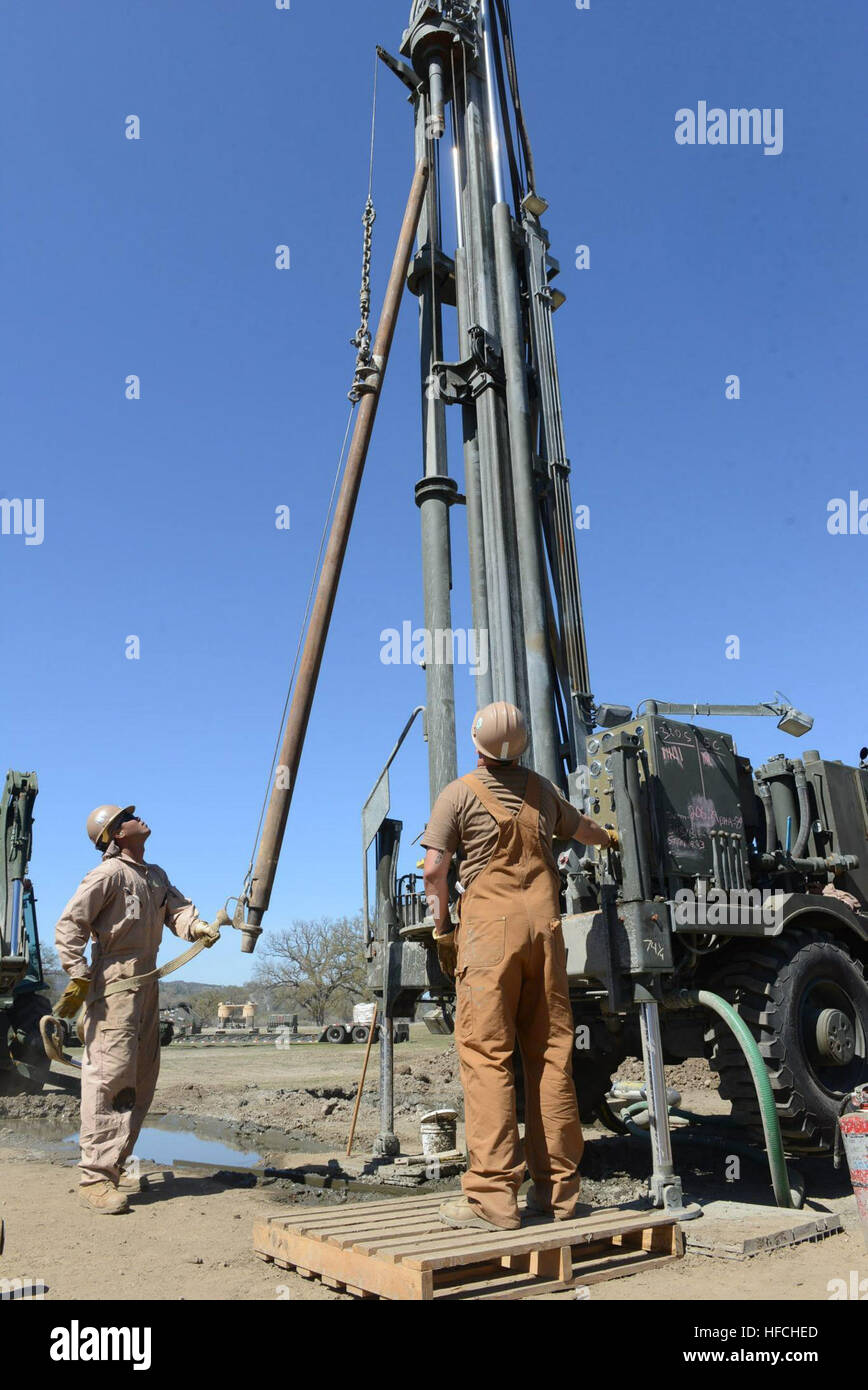 Members of Naval Mobile Construction Battalion 4's water well team ...