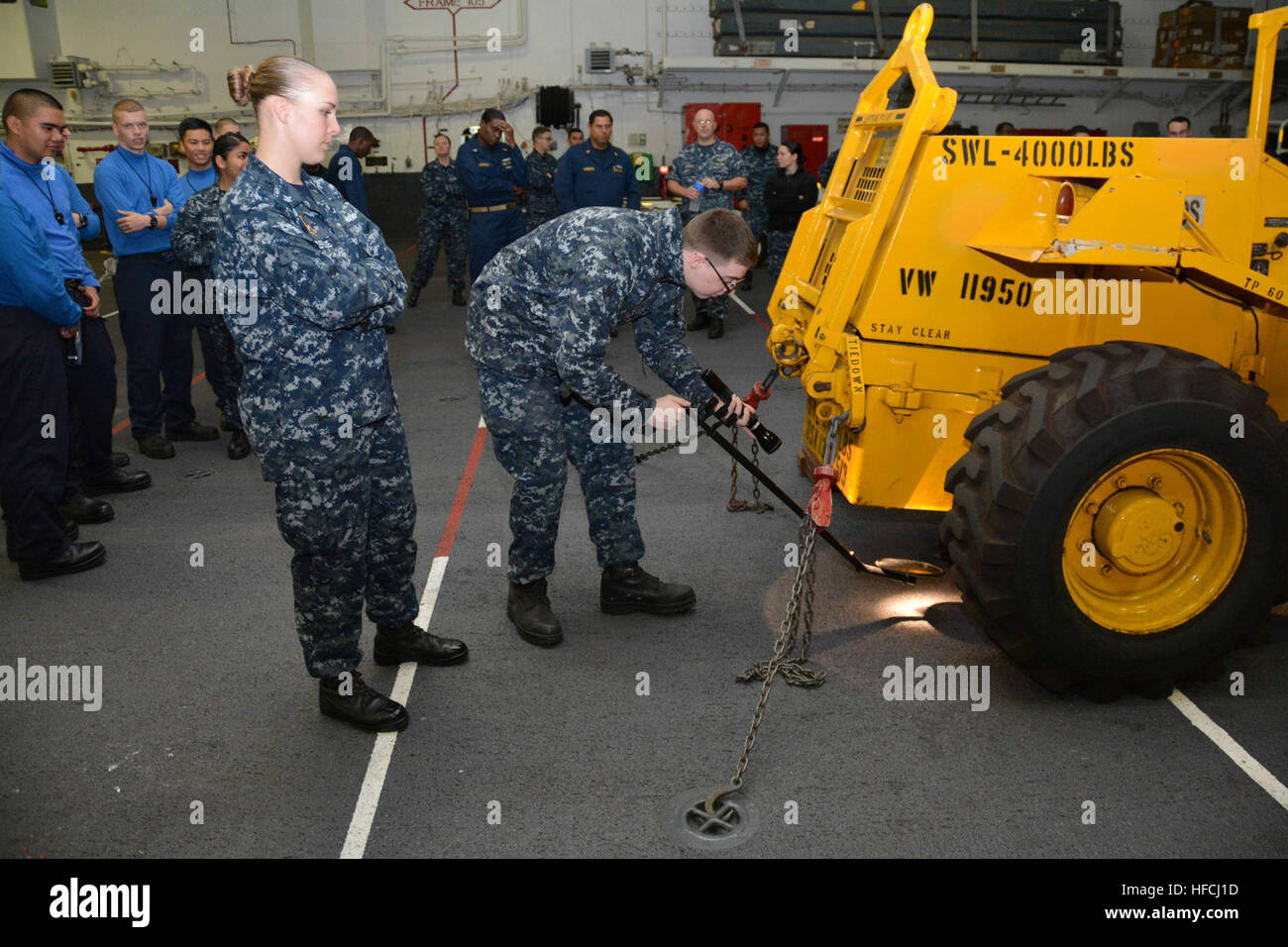 U.S. Navy Master-at-Arms 2nd Class Bridgett Perdue, left, observes ...