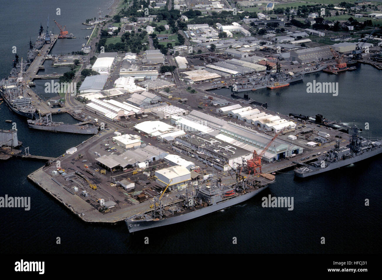 A view of the pier area with docked ships including the auxiliary ...