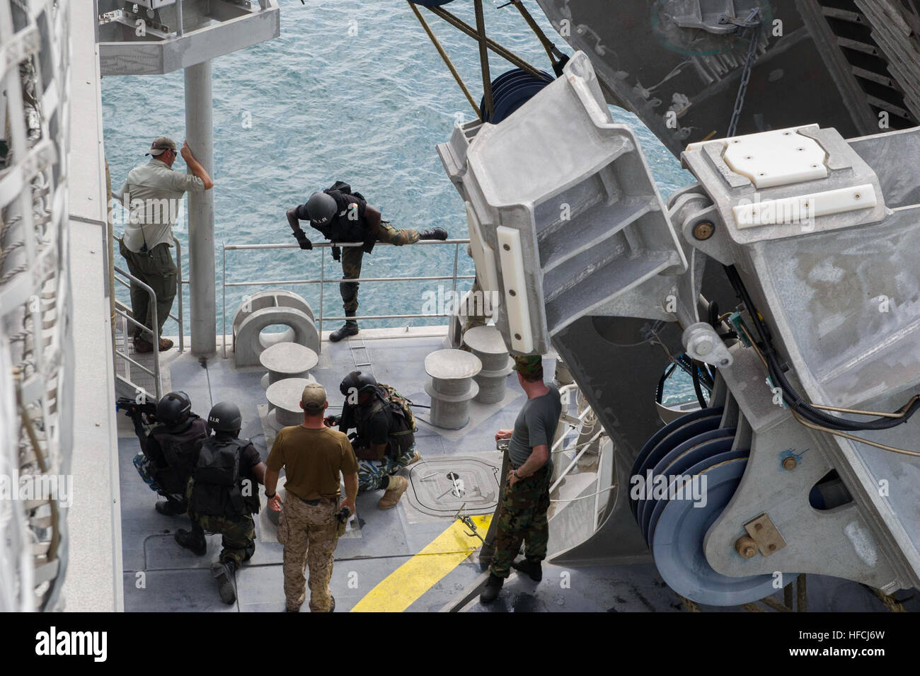 U.S. Sailors with Naval Special Warfare Group 10, Nigerian sailors with ...