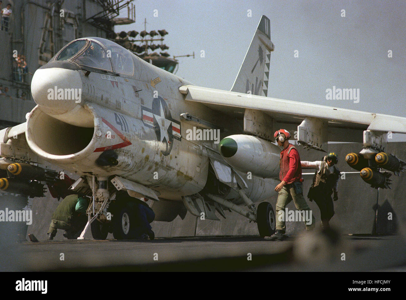 An A-7 Corsair II attack aircraft is prepared for launch aboard the ...